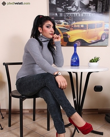 Gorgeous Sharon smoking a cigarette and showing off her nyloned feet